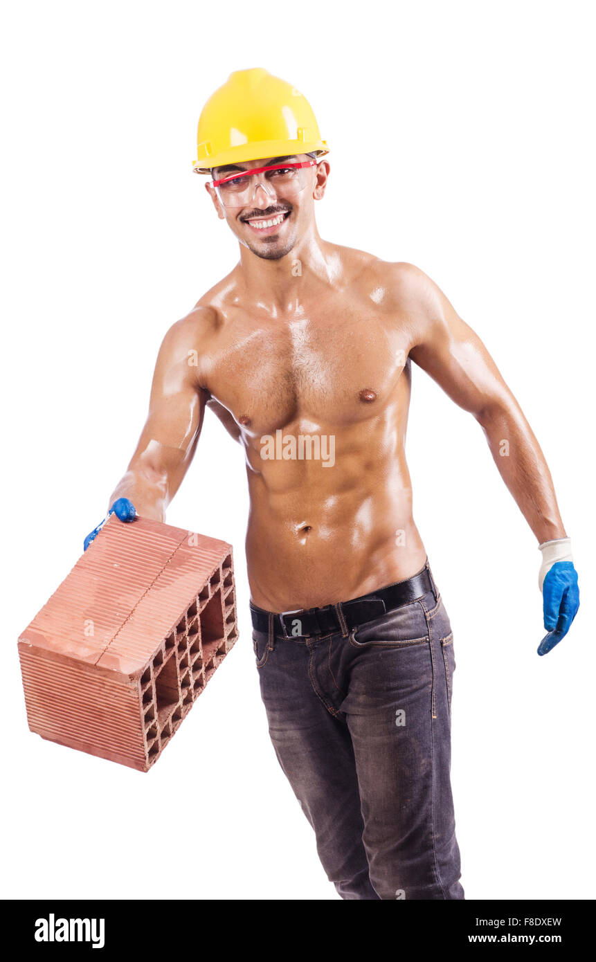 Muscular builder with bricks on white Stock Photo - Alamy