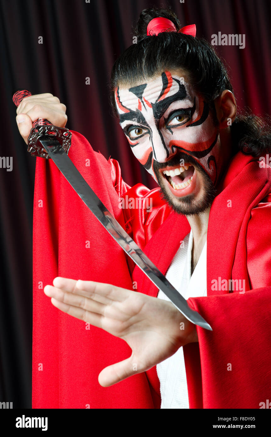 Man with sword and face mask Stock Photo - Alamy