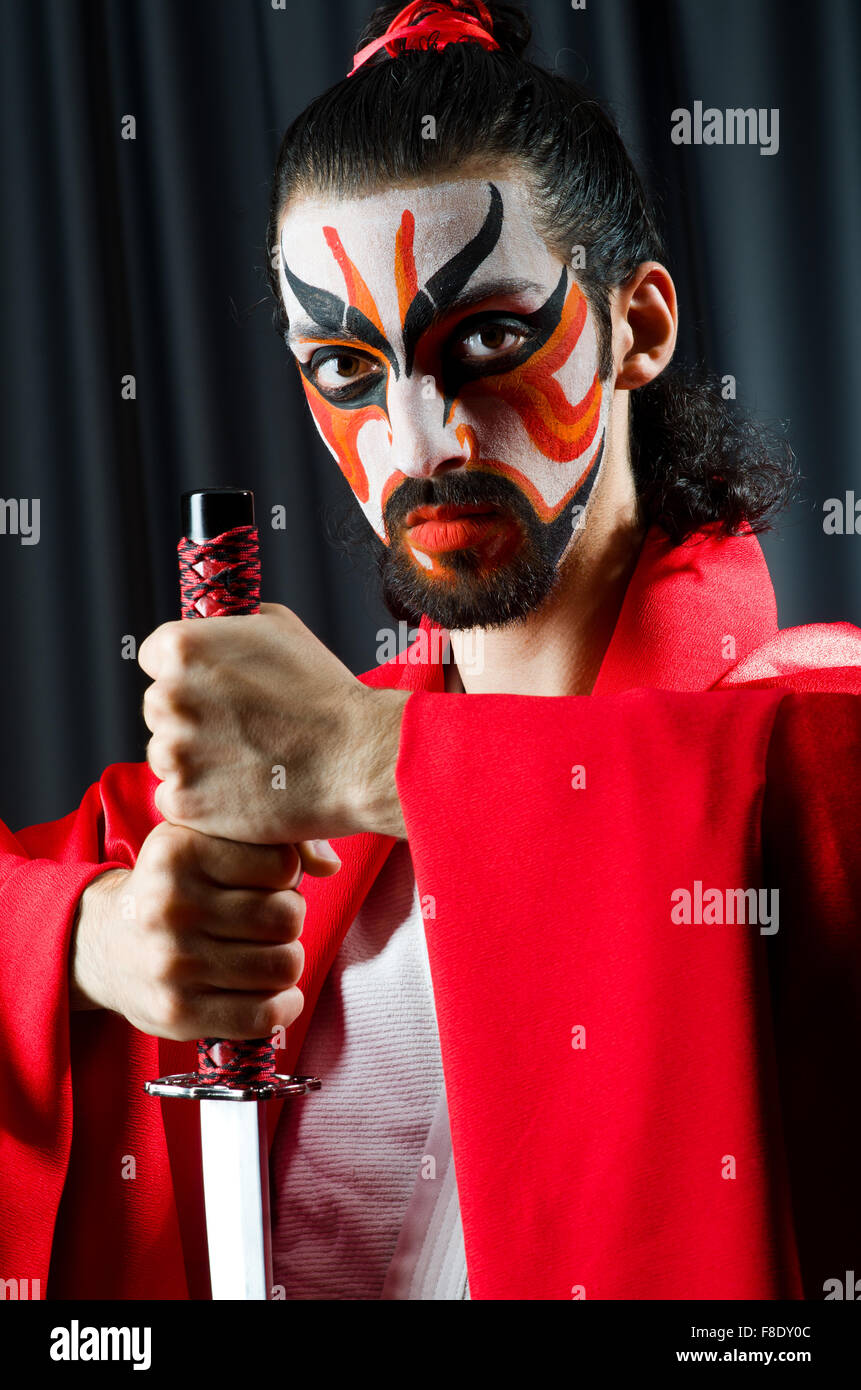 Man with sword and face mask Stock Photo - Alamy