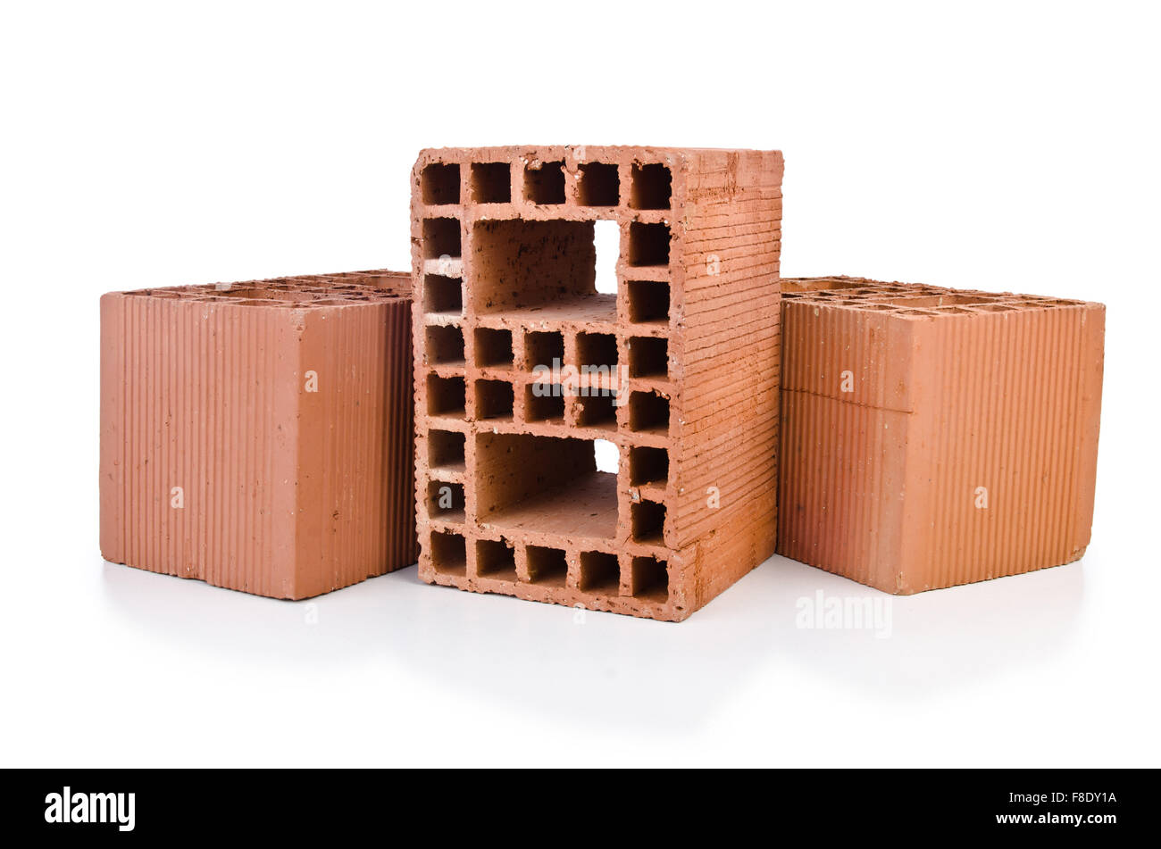 Stack of clay bricks isolated on white Stock Photo - Alamy