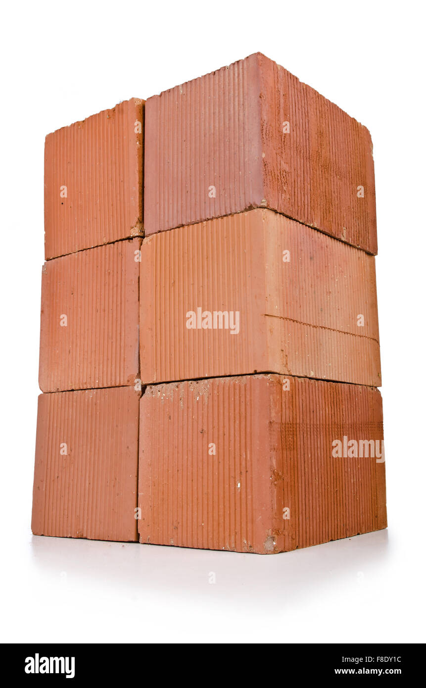 Stack of clay bricks isolated on white Stock Photo - Alamy
