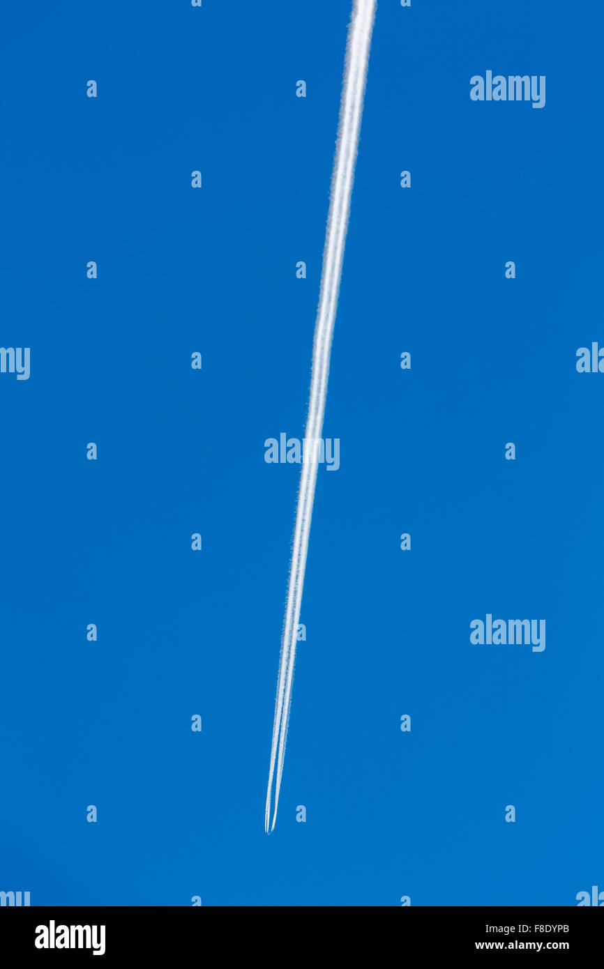 Closeup on airplane contrail against clear blue sky with the Aconcagua ...