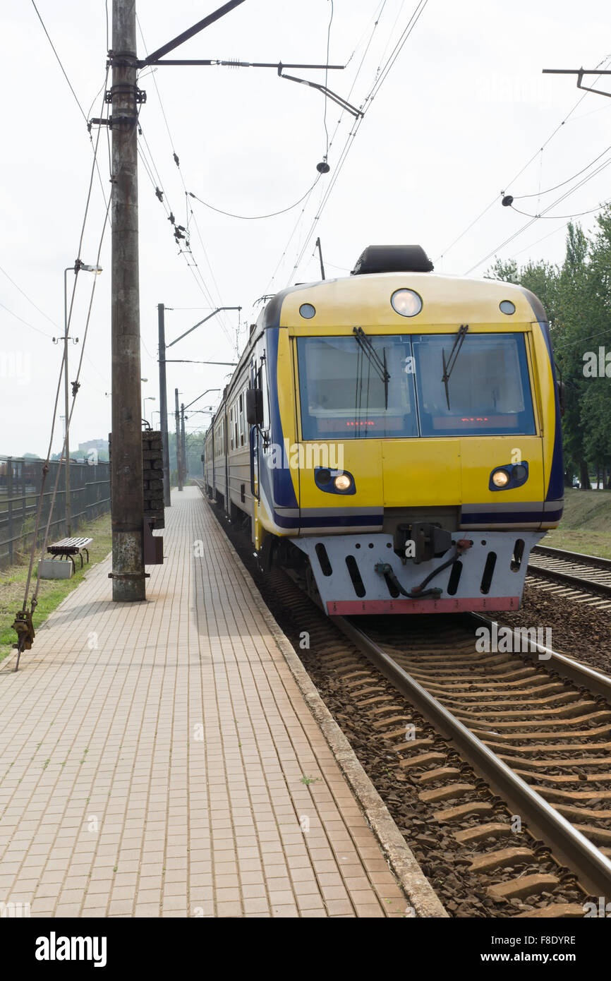 the train of yellow and blue color costs on railway tracks Stock Photo ...