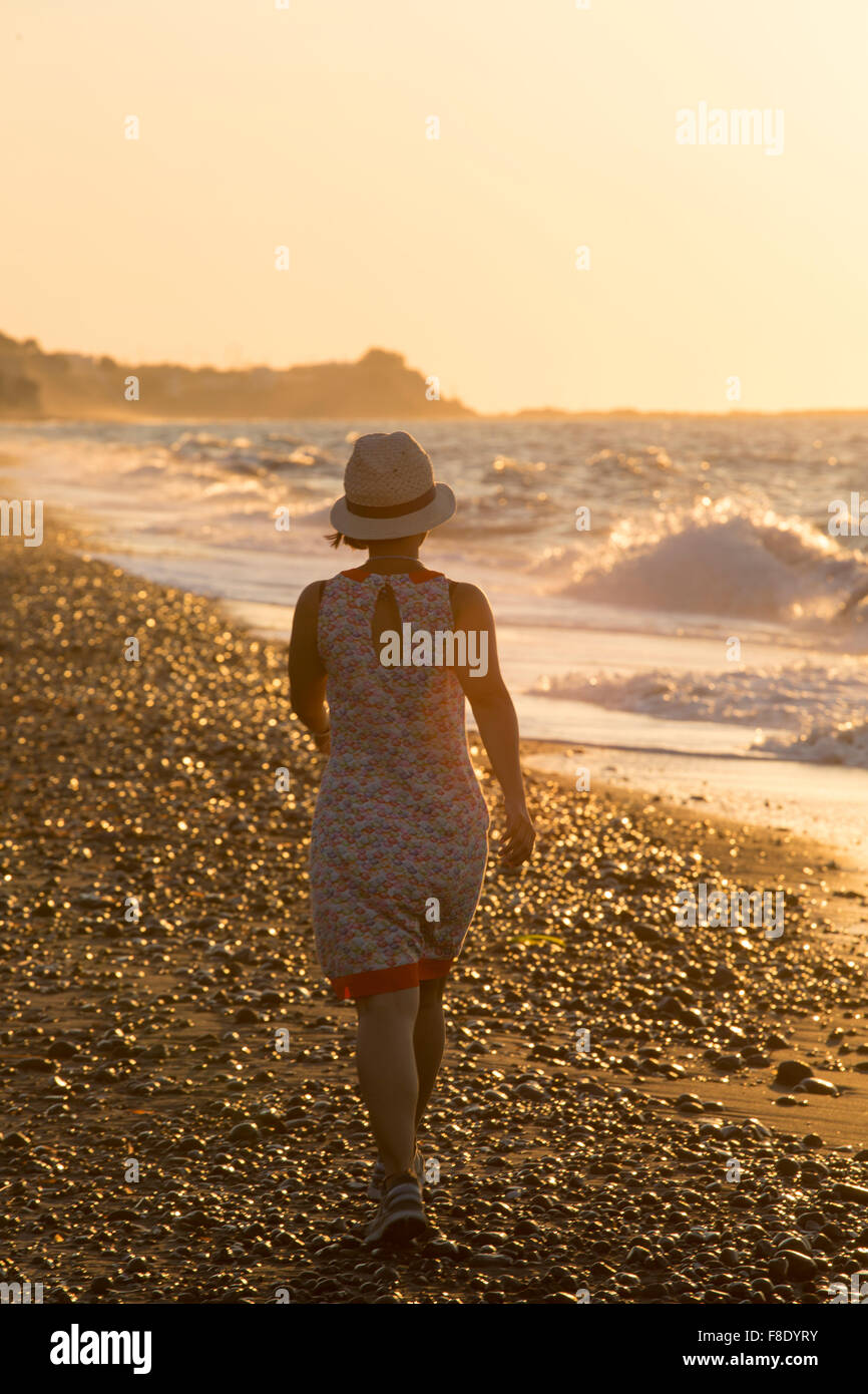Woman walking on red hi-res stock photography and images - Alamy