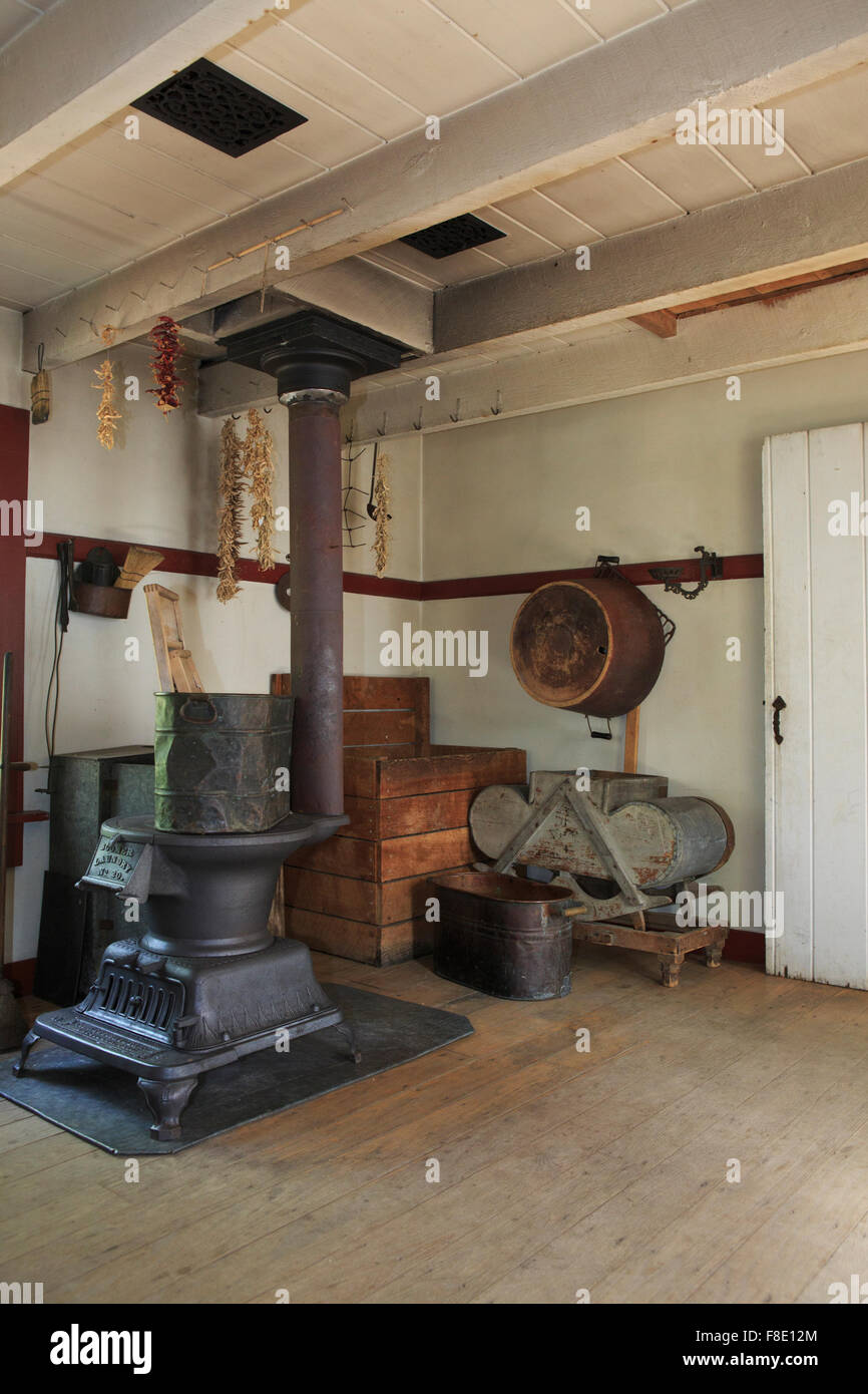 Heating stove in summer kitchen, traditional 19'th century farmhouse ...