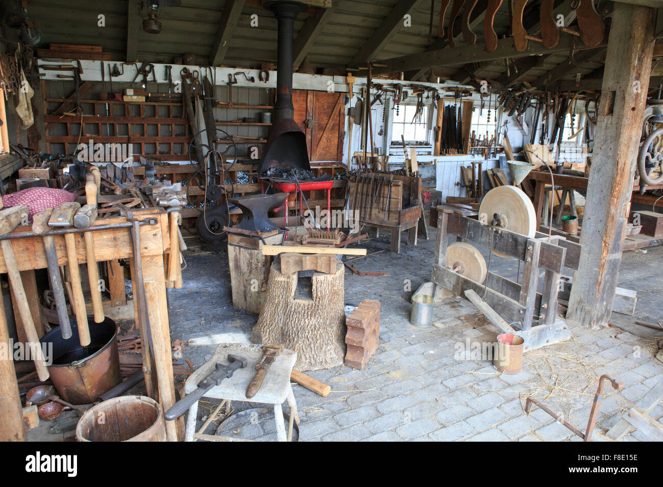 Blacksmith equipment in a shed Stock Photo - Alamy