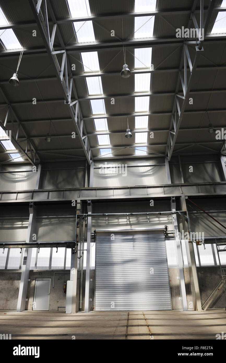 big industry garage door indoor in company hall Stock Photo - Alamy