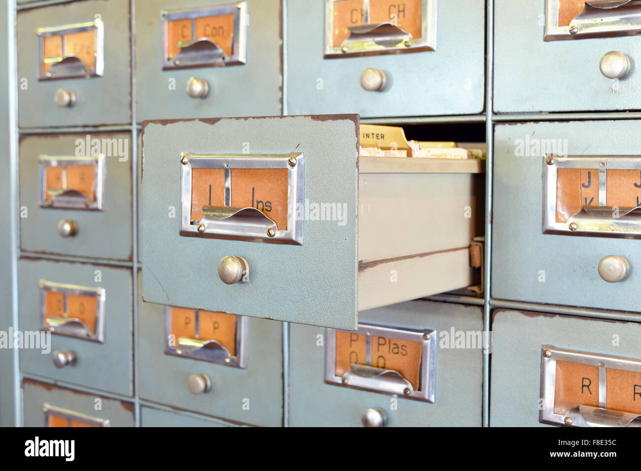 Filing cabinet with single drawer opened. Office concept Stock Photo ...