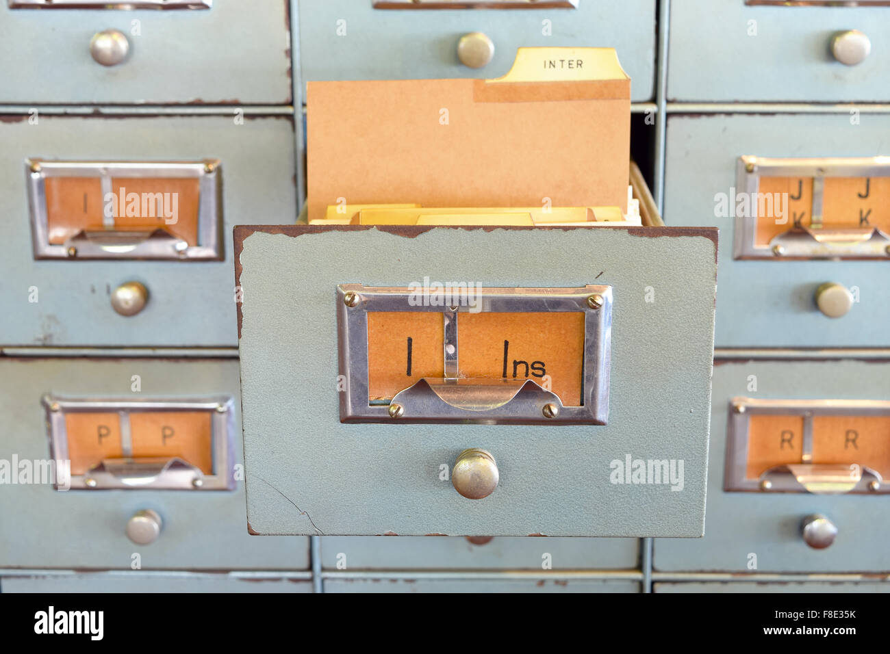 Filing cabinet with single document file in open drawer. Office concept ...