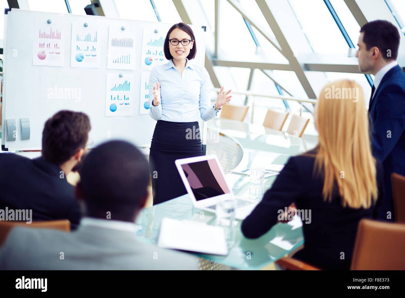 Young businesswoman reporting on business results of the financial ...