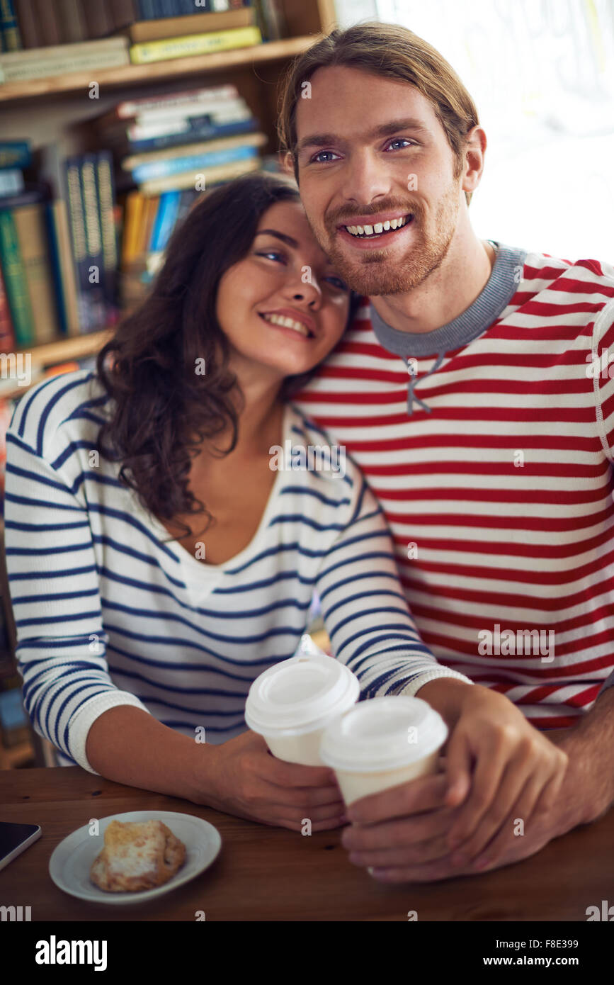 Loving couple drinking coffee together at cafe Stock Photo - Alamy