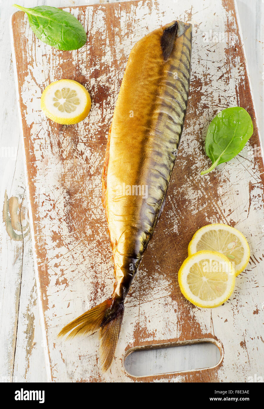 Smoked fish on wooden board. Top view Stock Photo - Alamy