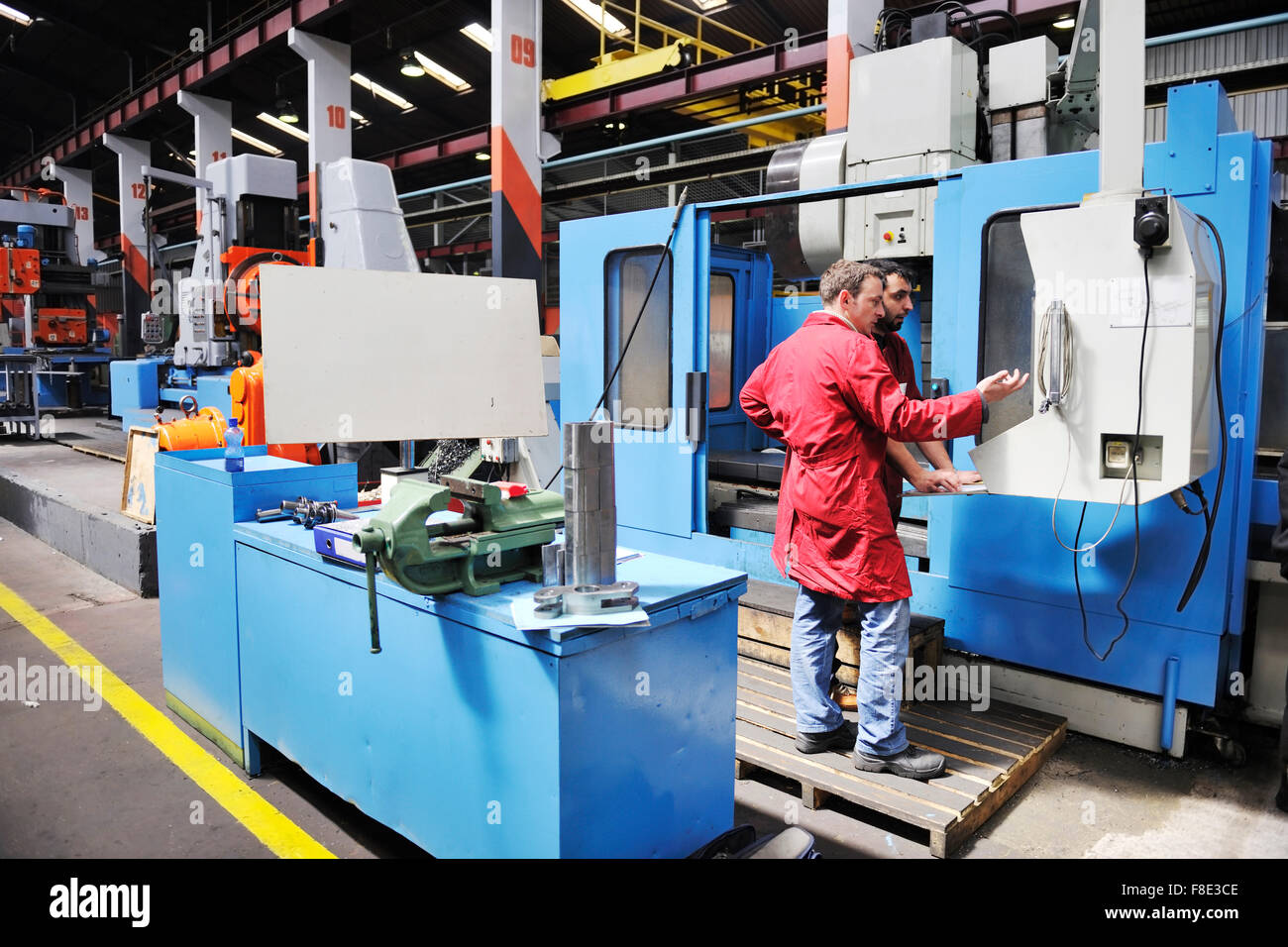 engineering people manofacturing industry with big modern computer ...