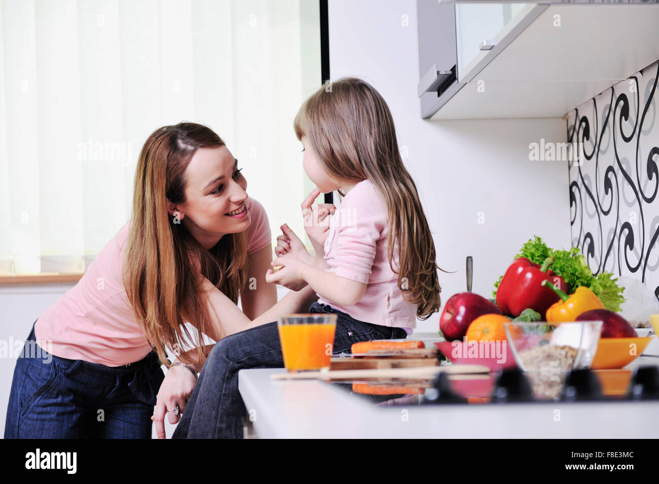 happy young family have lunch time with fresh fruits and vegetable food ...