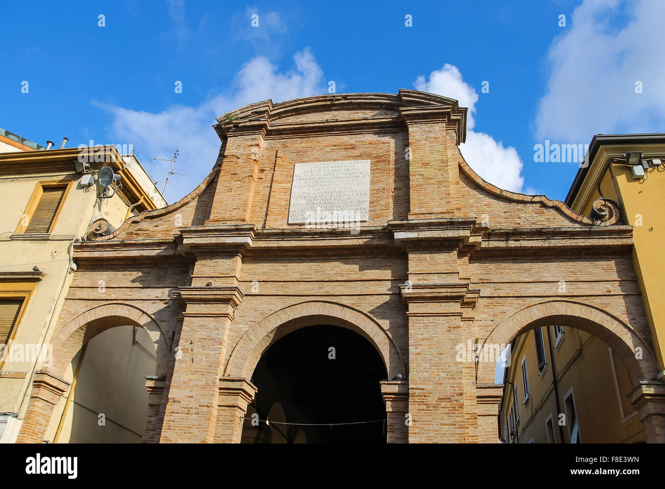 Ancient wall with arch on Cavour square in Rimini, Italy Stock Photo ...