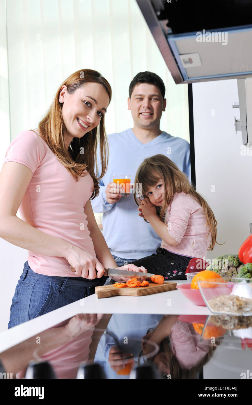 happy young family have lunch time with fresh fruits and vegetable food ...