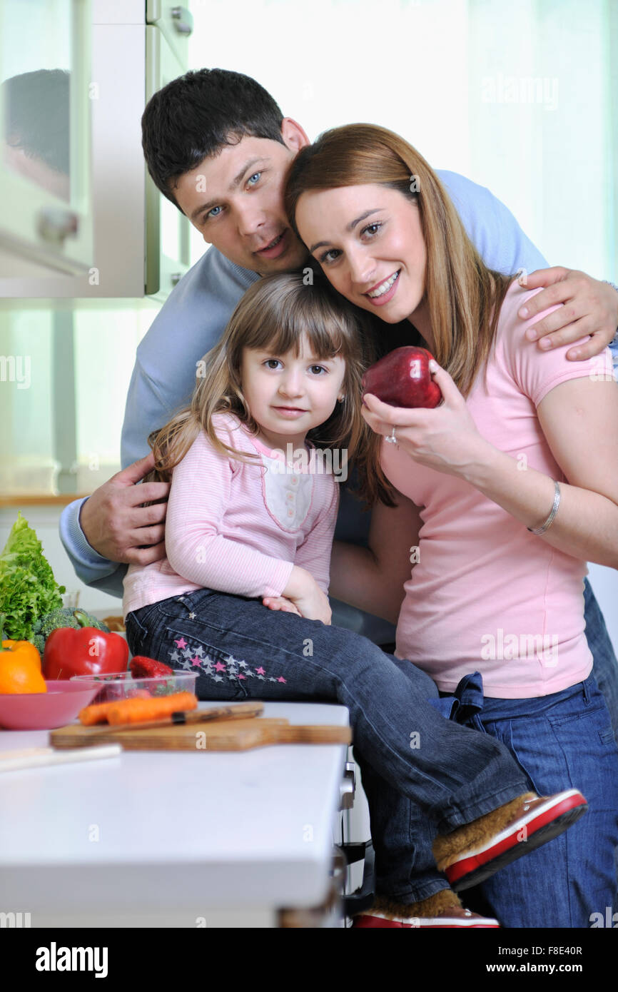 happy young family have lunch time with fresh fruits and vegetable food ...
