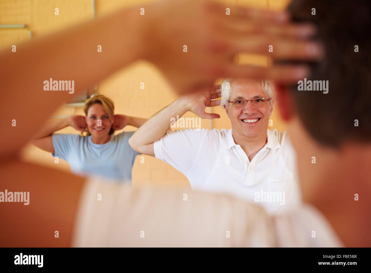 Gym class working out with fitness coach Stock Photo - Alamy