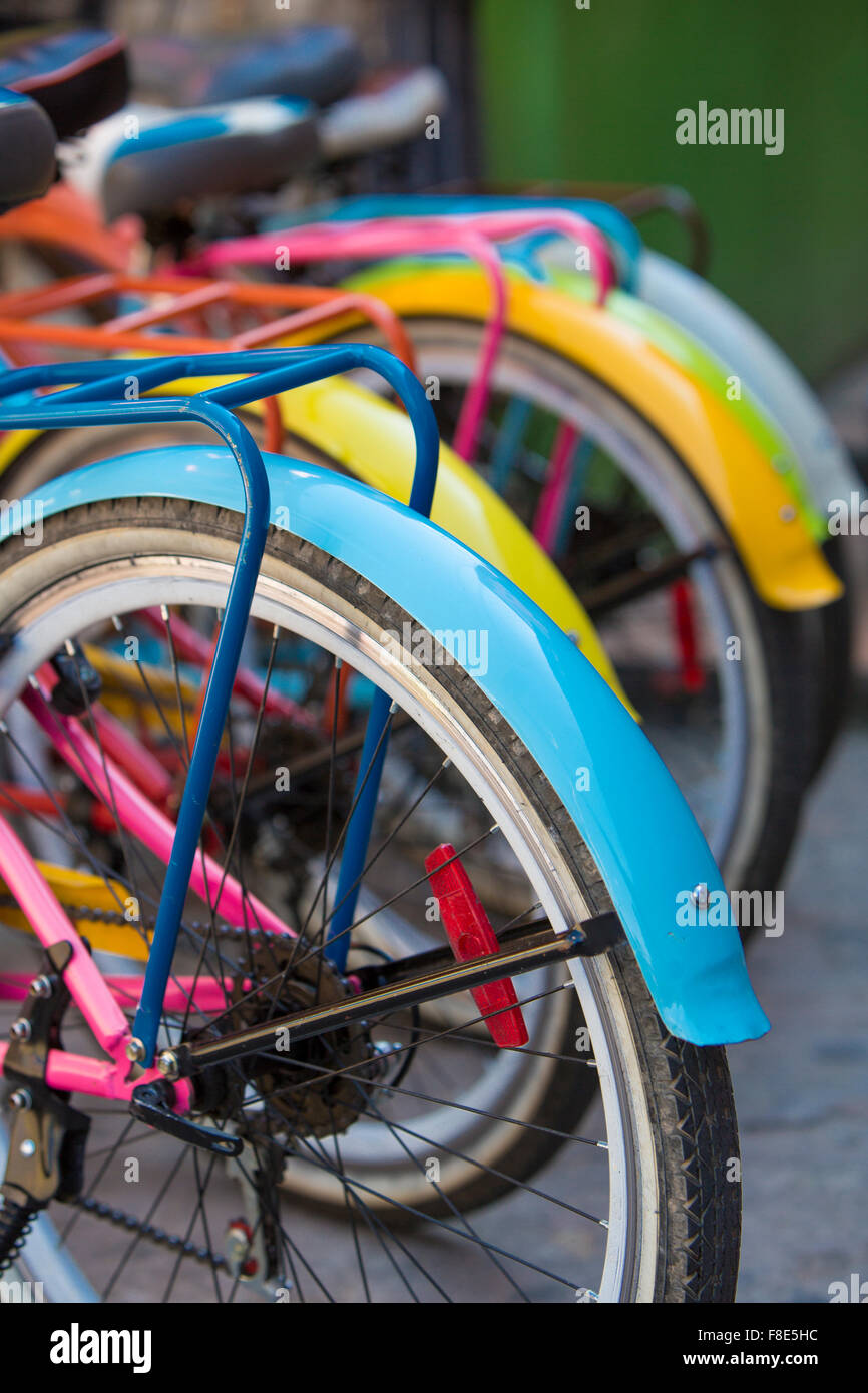 Various colored bikes standing guatape hi-res stock photography and ...
