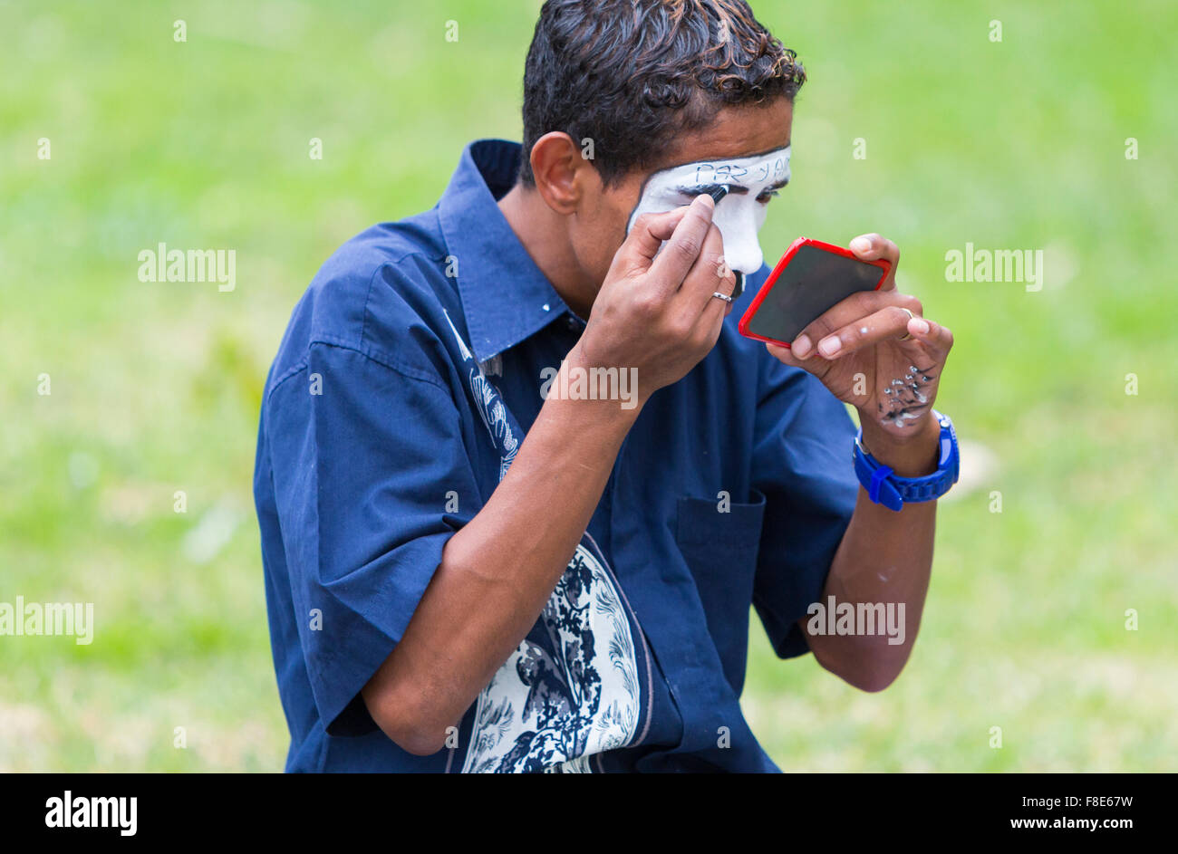 Clown getting ready in park in medellin hi-res stock photography and ...