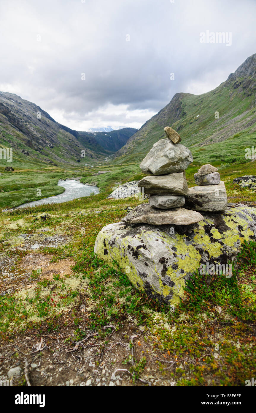 Stack of stones in front of valley Stock Photo - Alamy