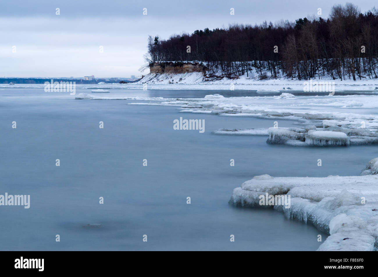 Ice-coated coast of baltic sea, overcast winter landscape Stock Photo ...