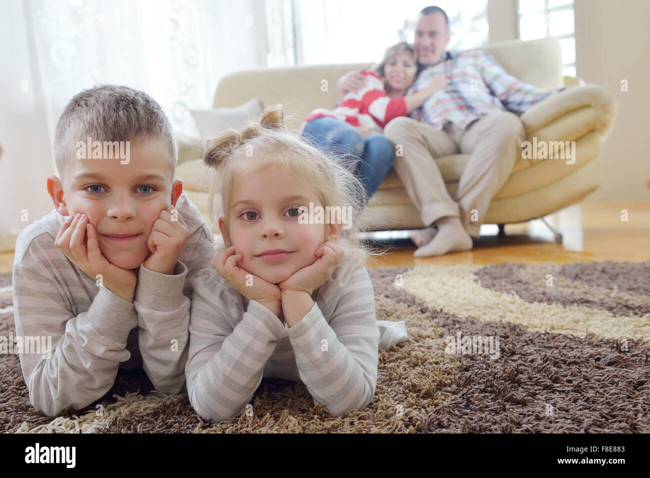 hapy young family have fun with their children at modern living room ...