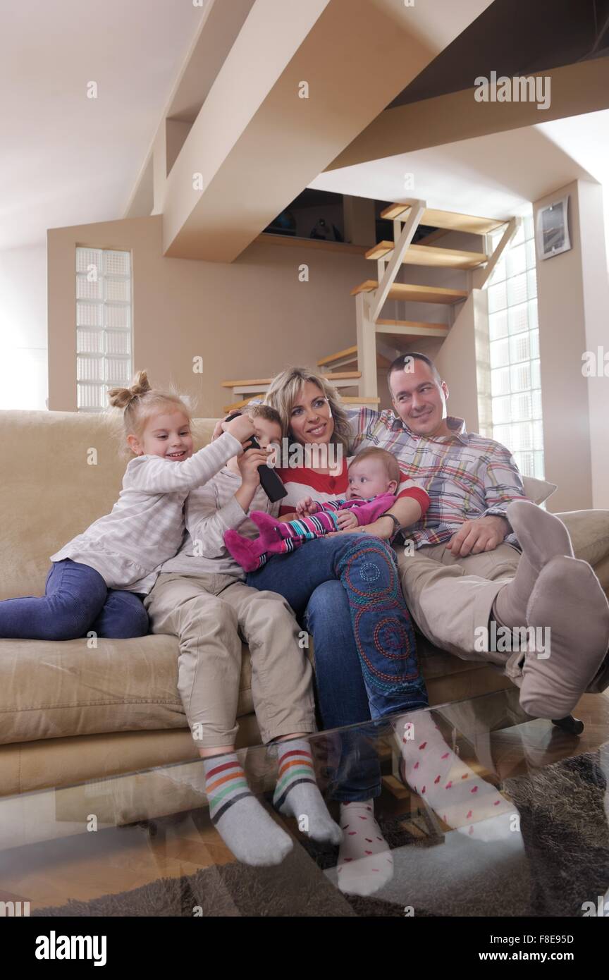 hapy young family have fun with their children at modern living room ...