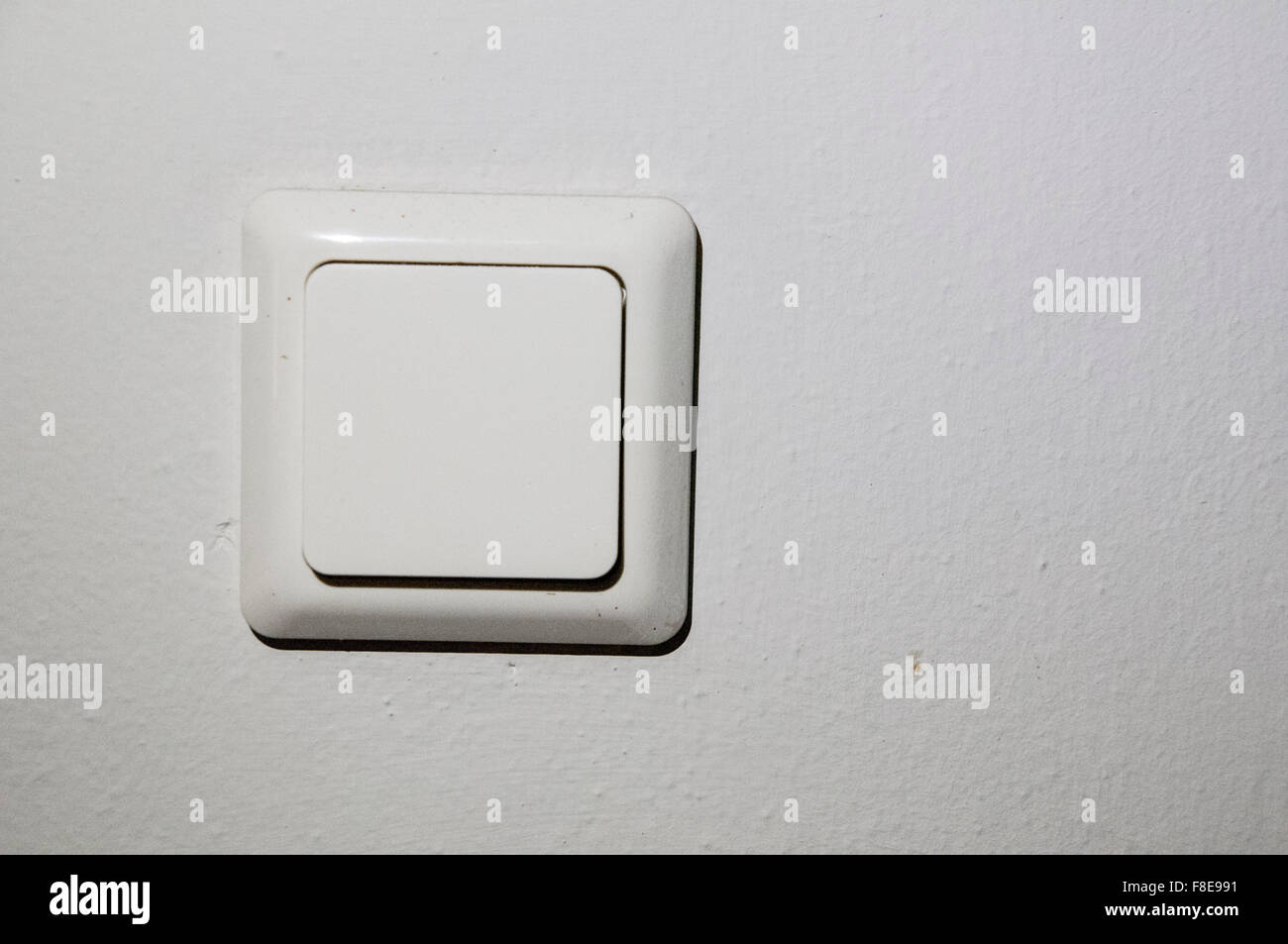 Light switch on a wall Stock Photo - Alamy