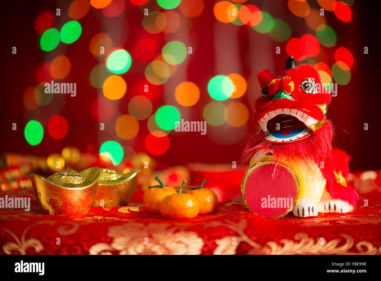 Chinese new year festival decorations, miniature dancing lion and gold ...