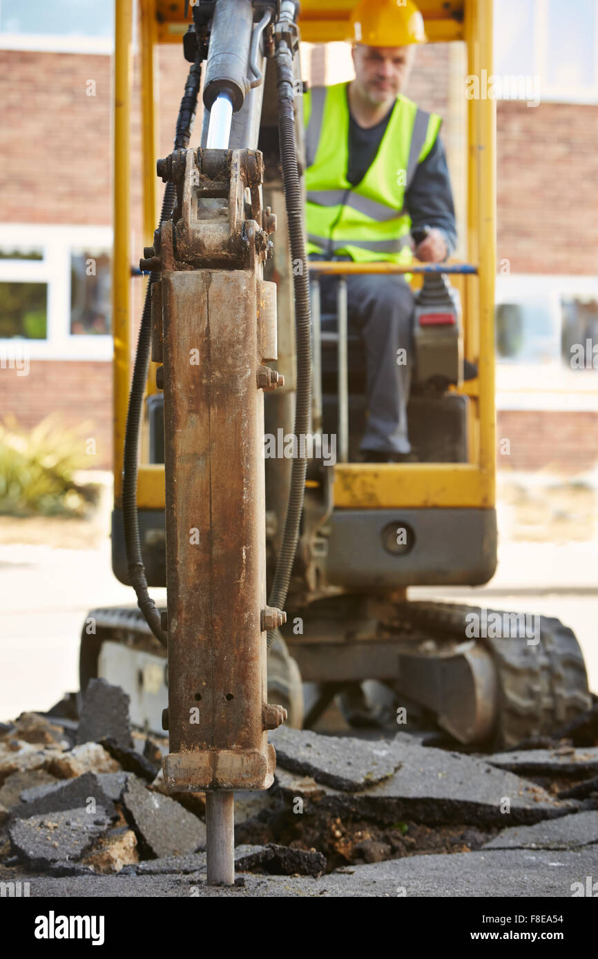 Construction Worker Operating Digger On Site Stock Photo - Alamy