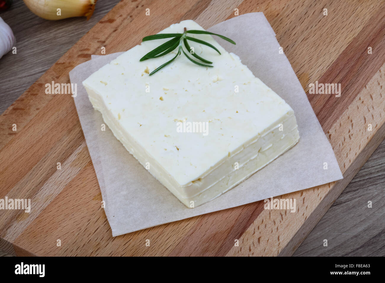 Traditional Caucasian homemade Cheese Brinza with rosemary on wood ...