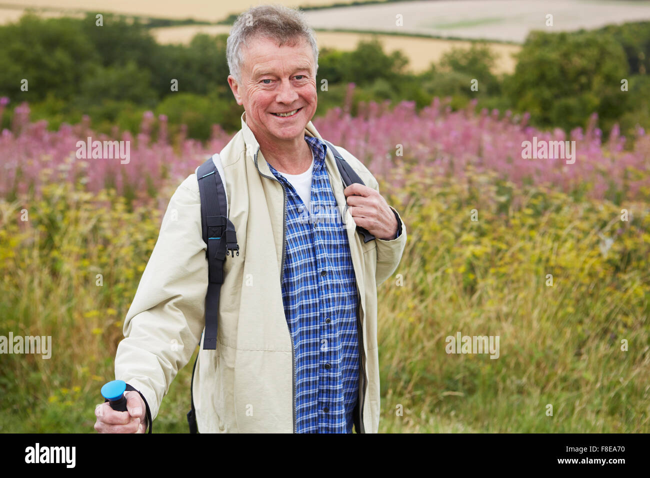 Senior Man Enjoying Hike In The Countryside Stock Photo - Alamy