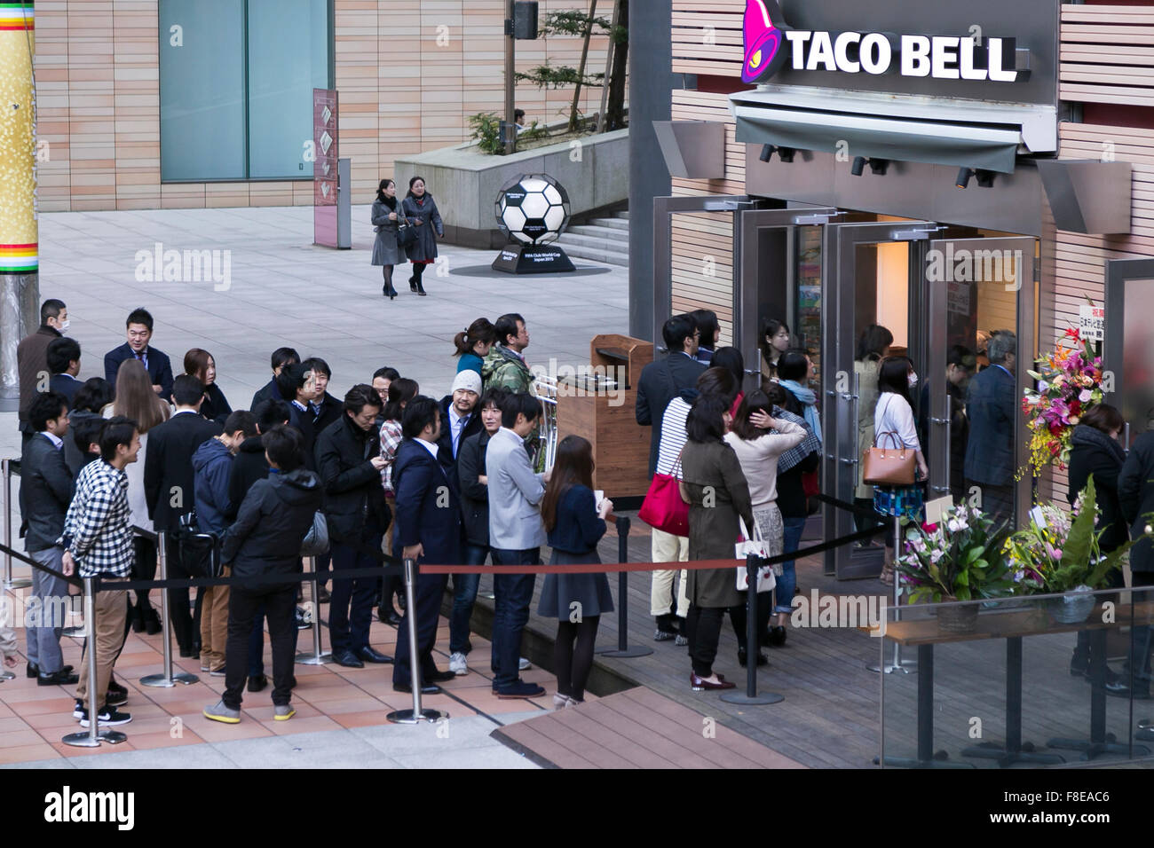 Customers line up outside the new Taco Bell branch at the Nippon ...