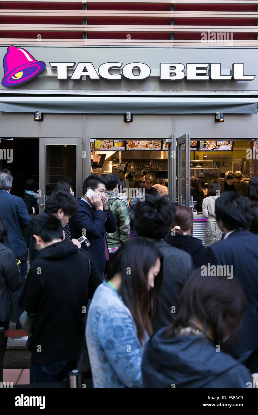 Customers line up outside the new Taco Bell branch at the Nippon ...