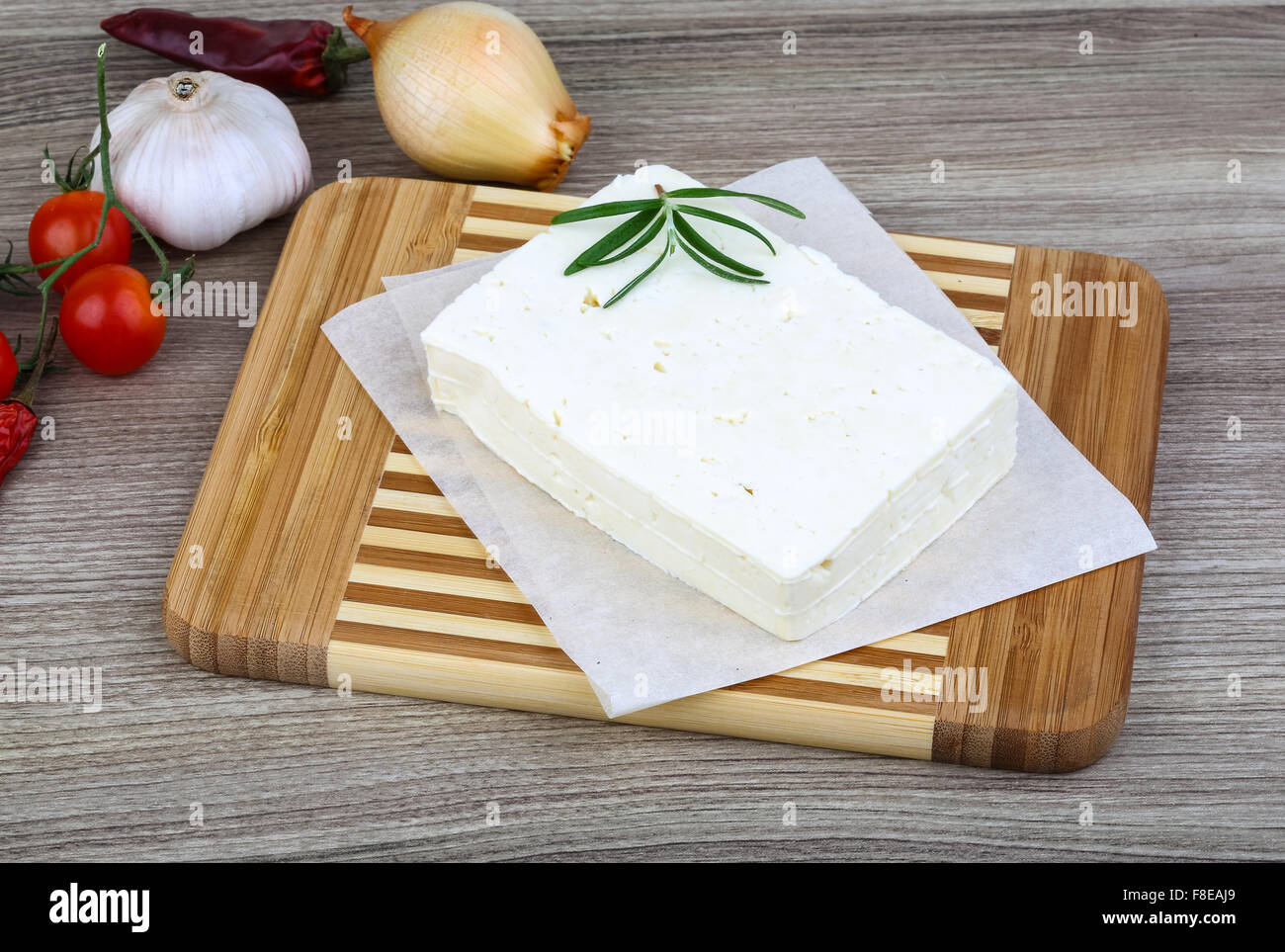Traditional Caucasian homemade Cheese Brinza with rosemary on wood ...