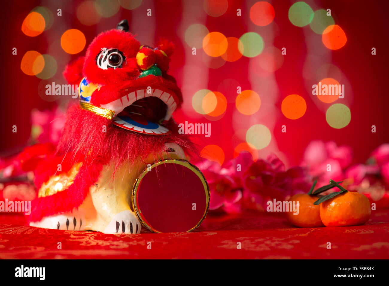 Chinese new year decorations, miniature dancing lion and mandarin ...