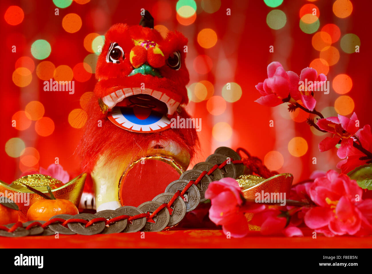 Chinese new year decorations, miniature dancing lion and ancient money ...