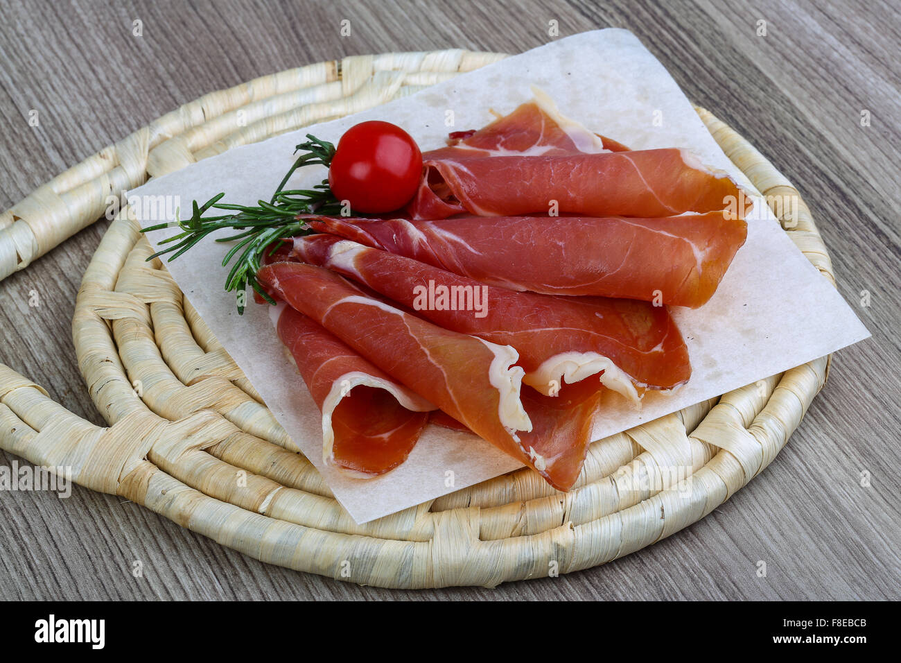 Spanish traditional snack - Jamon with tomato and rosemary Stock Photo ...