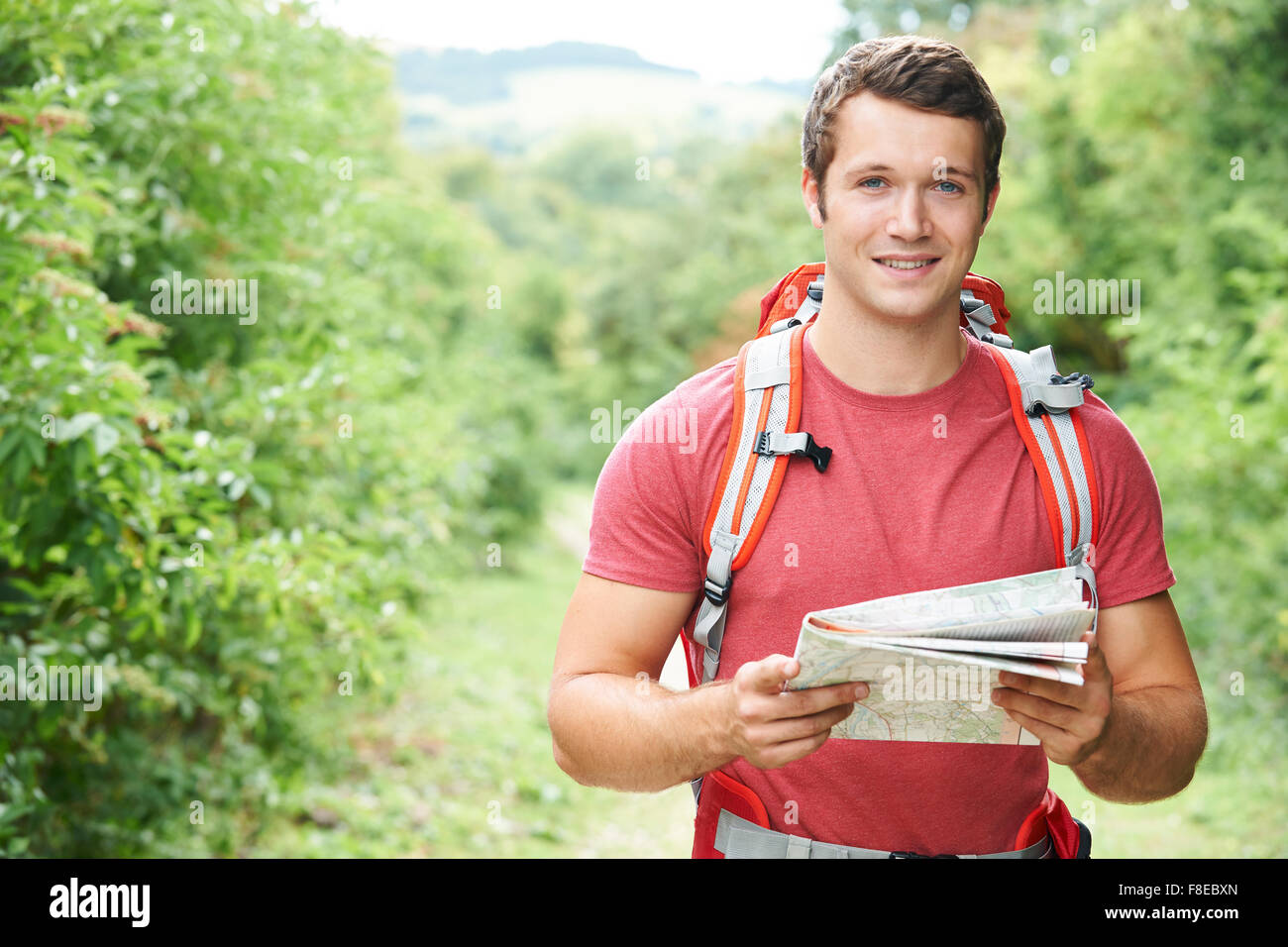 Active young man hiking through hi-res stock photography and images - Alamy