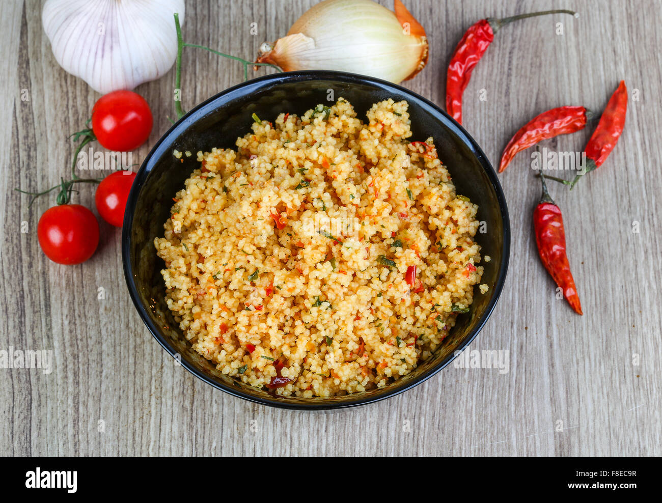 Arabic traditional cuisine - Couscous with tomato and green onion Stock ...