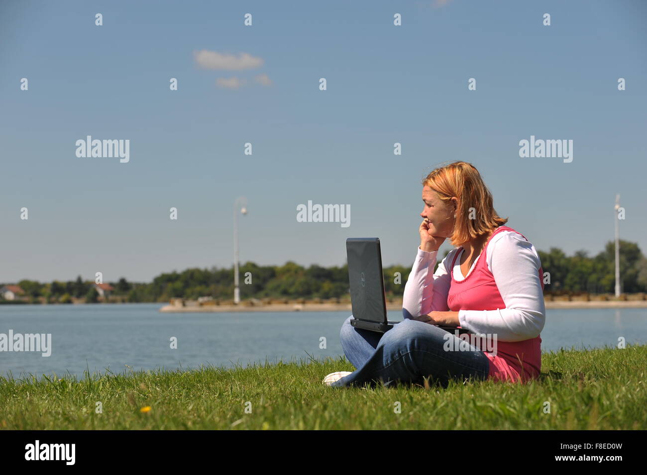 woman with laptop in nature Stock Photo - Alamy