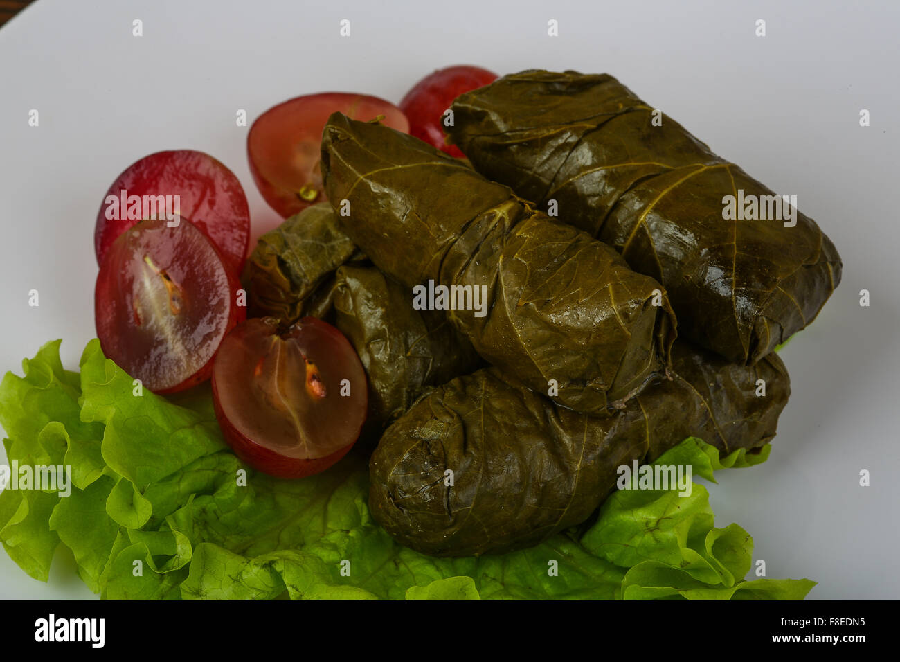 Dolma - minced meat in grape leaves with salad Stock Photo - Alamy
