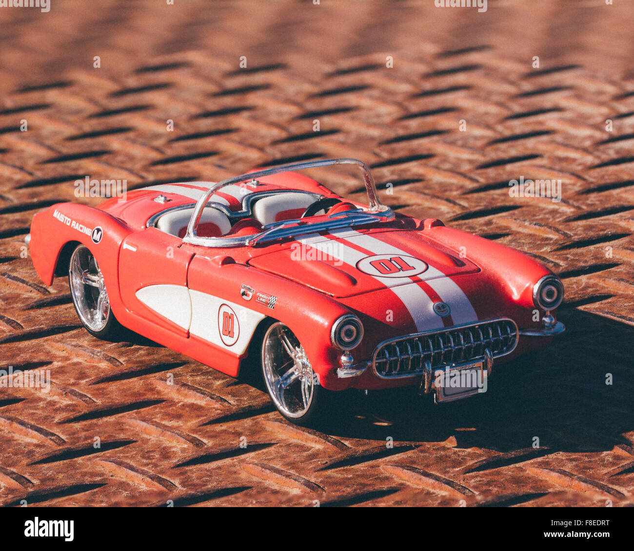 A red American classic car parked on rusted steel Stock Photo - Alamy