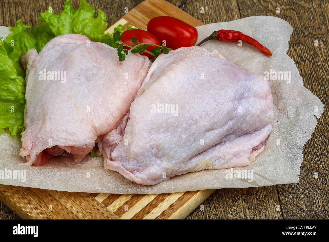 Raw chicken legs meat with herbs and spices ready for cooking Stock ...