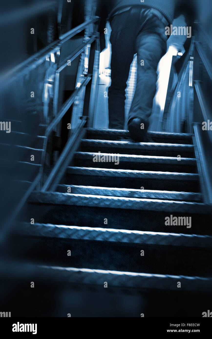 Man climbing stairs hi-res stock photography and images - Alamy