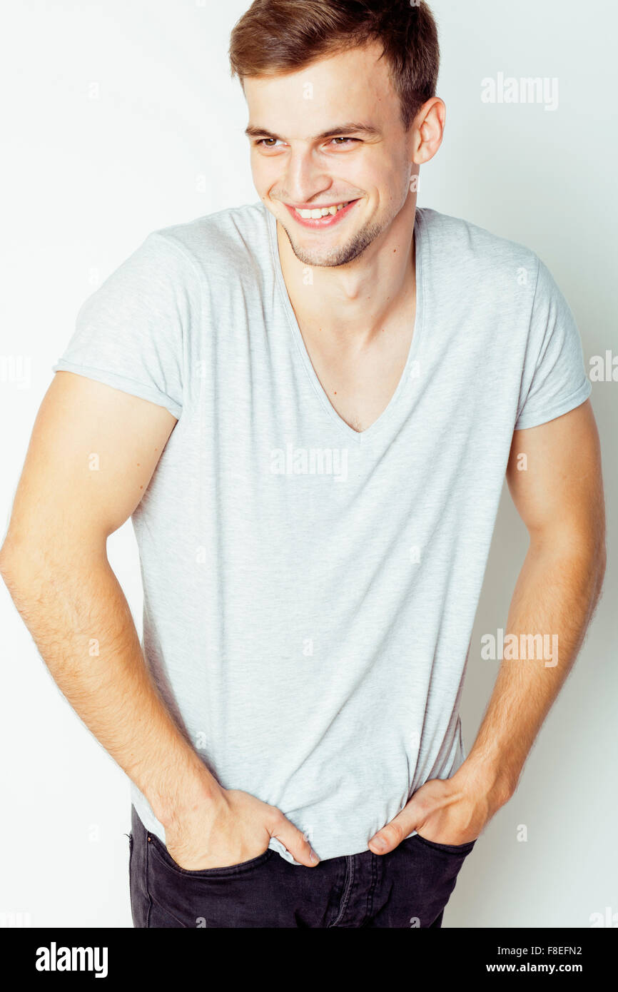 young handsome man on white background gesturing, pointing, posing ...