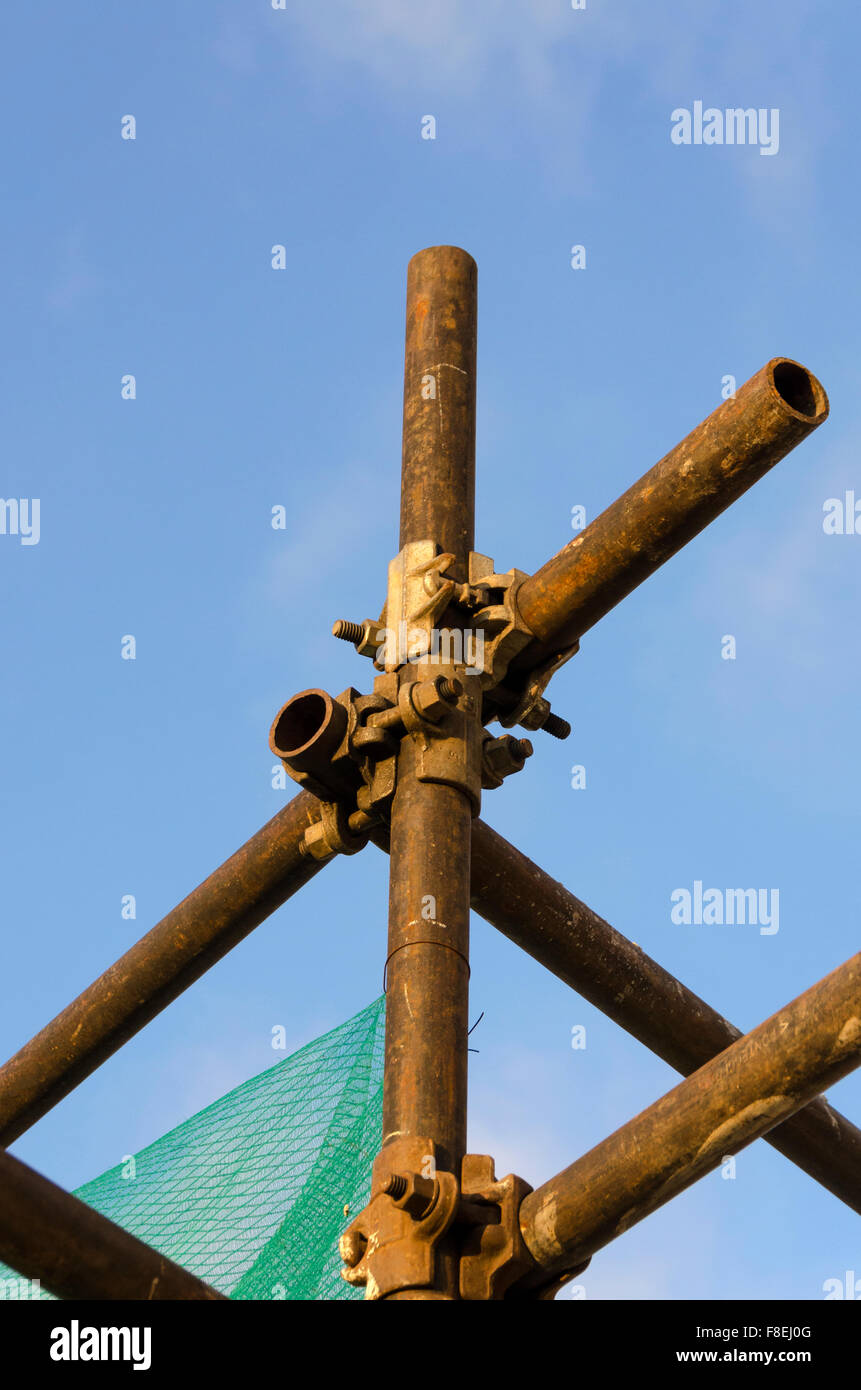 pipes and net from scaffolding on a construction site Stock Photo - Alamy