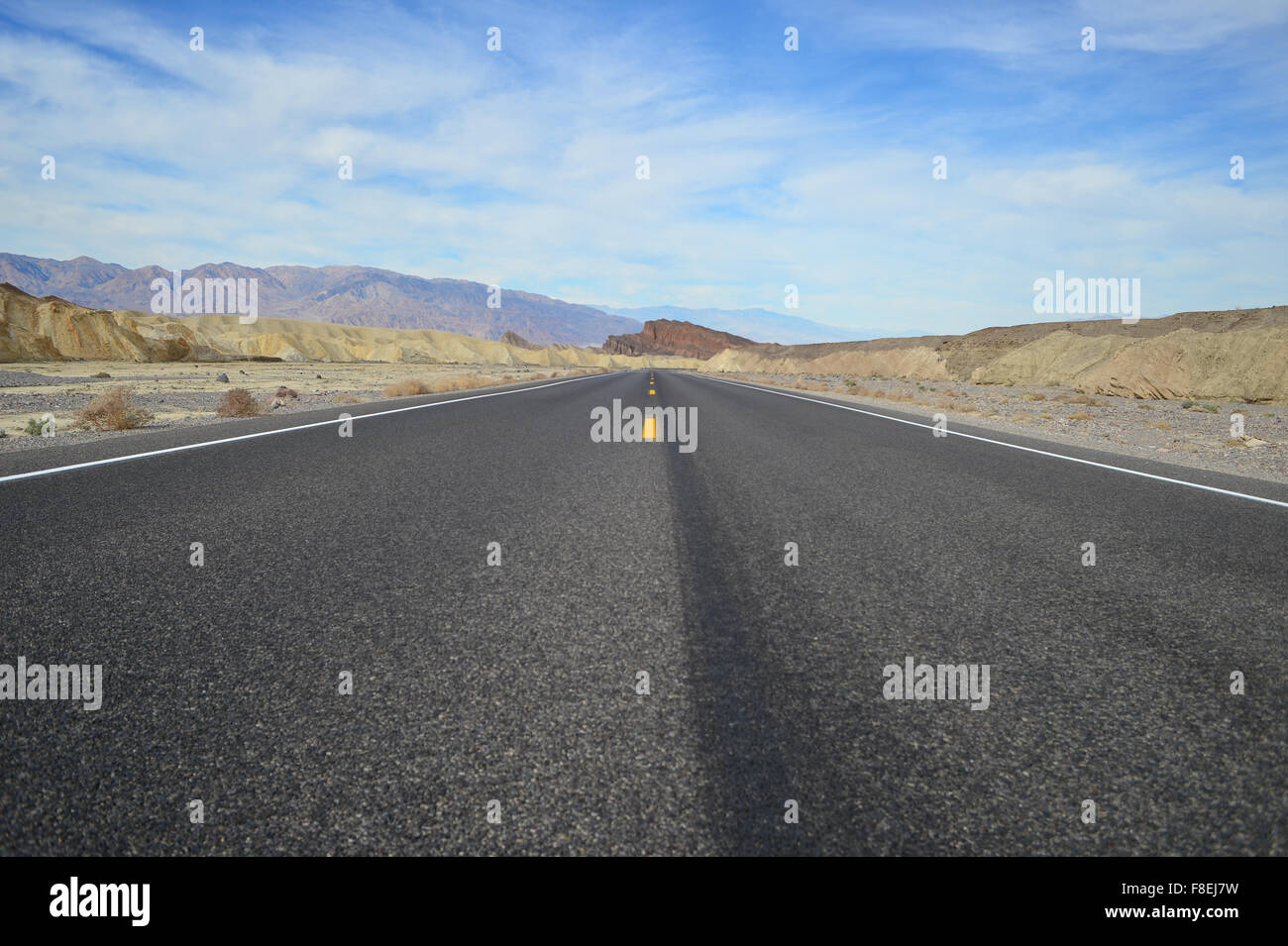 Empty desert road through Death Valley National Park Stock Photo - Alamy