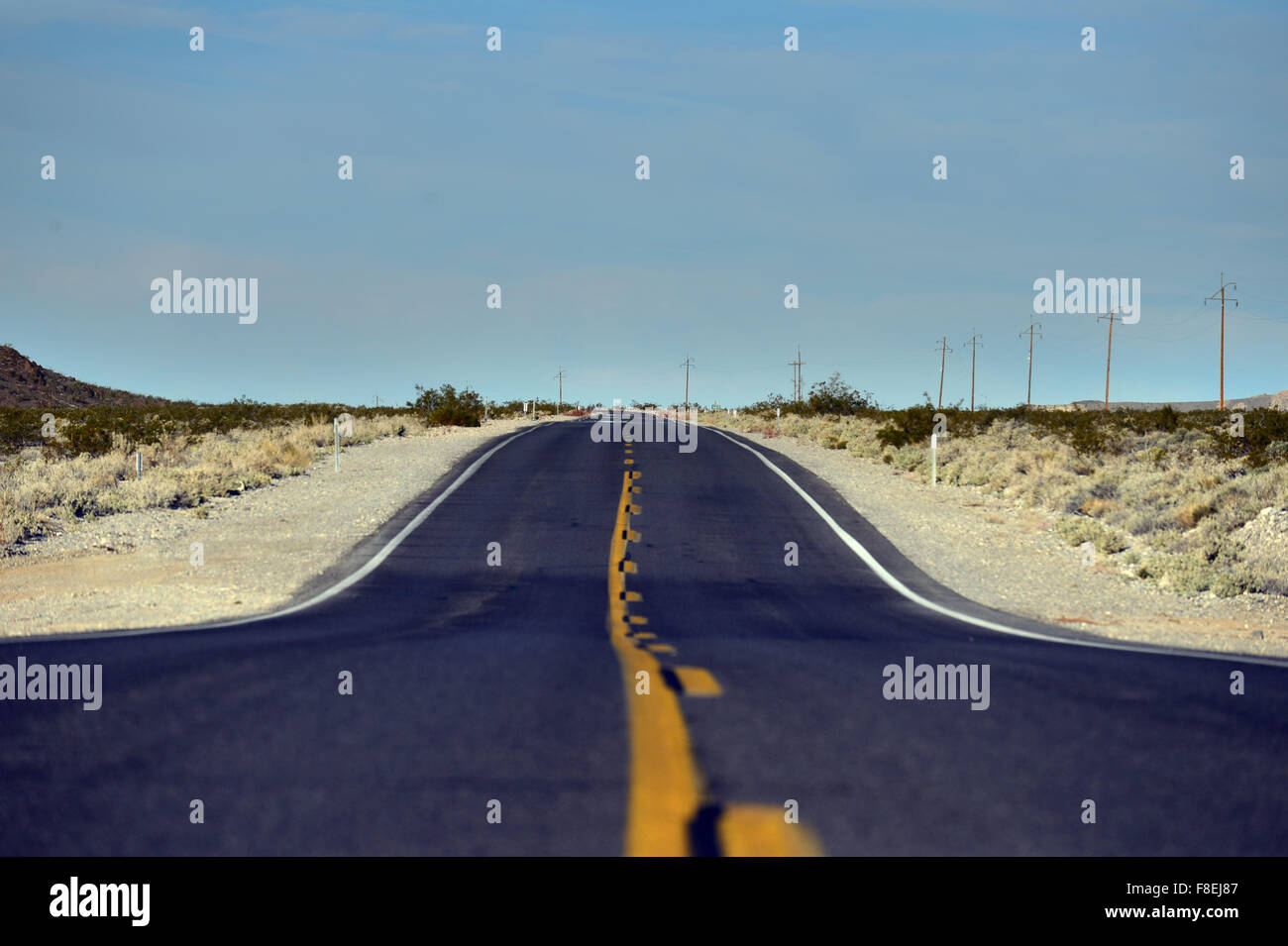 Empty desert road through Death Valley National Park Stock Photo - Alamy